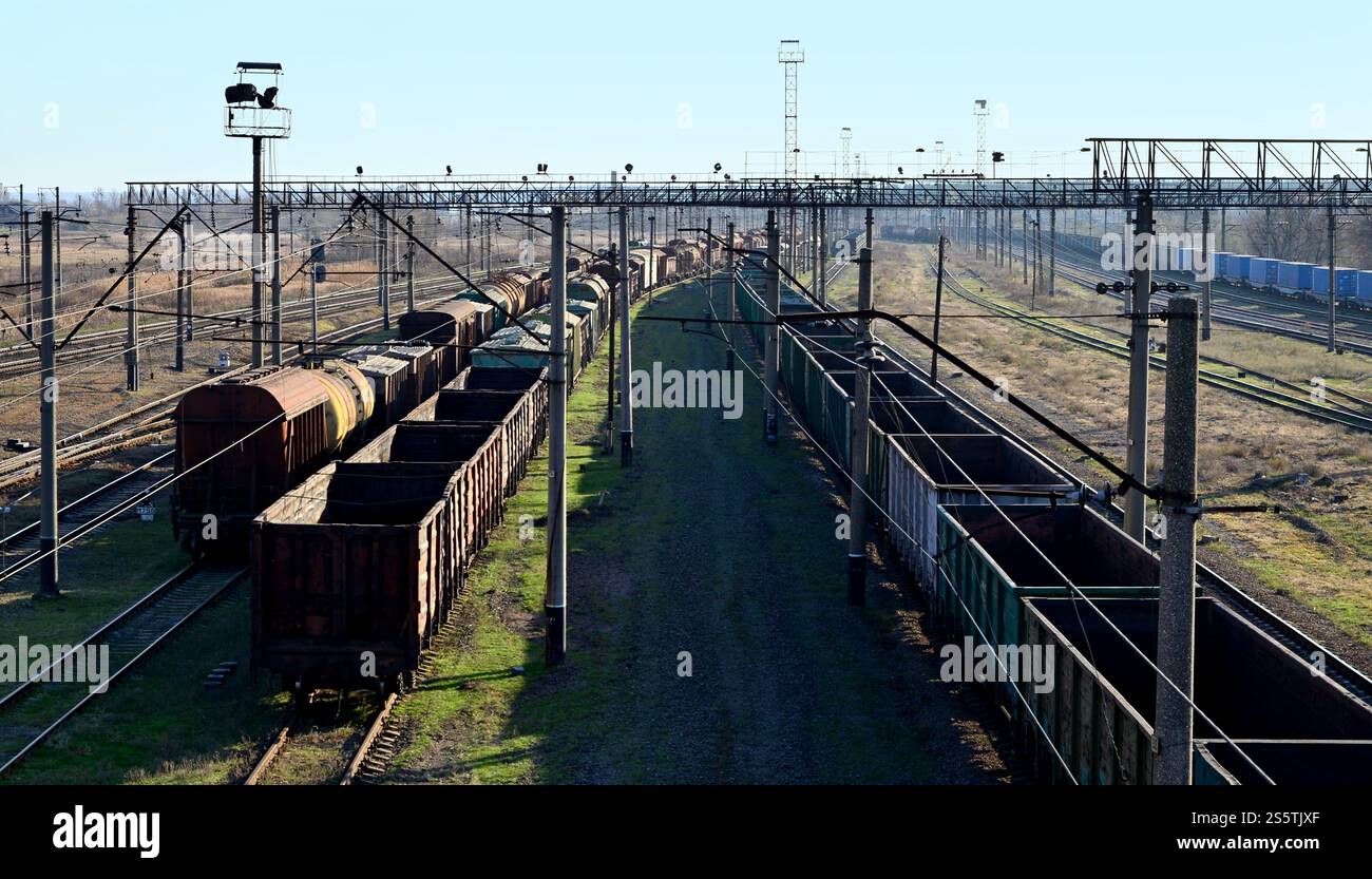 Railway landscape with many old railroad freight cars on the rails ...