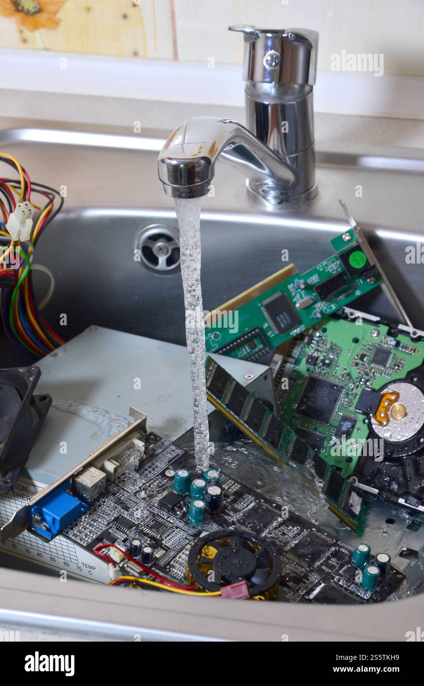 Personal computer cleaning metaphoric concept. Hardware in kitchen sink ...