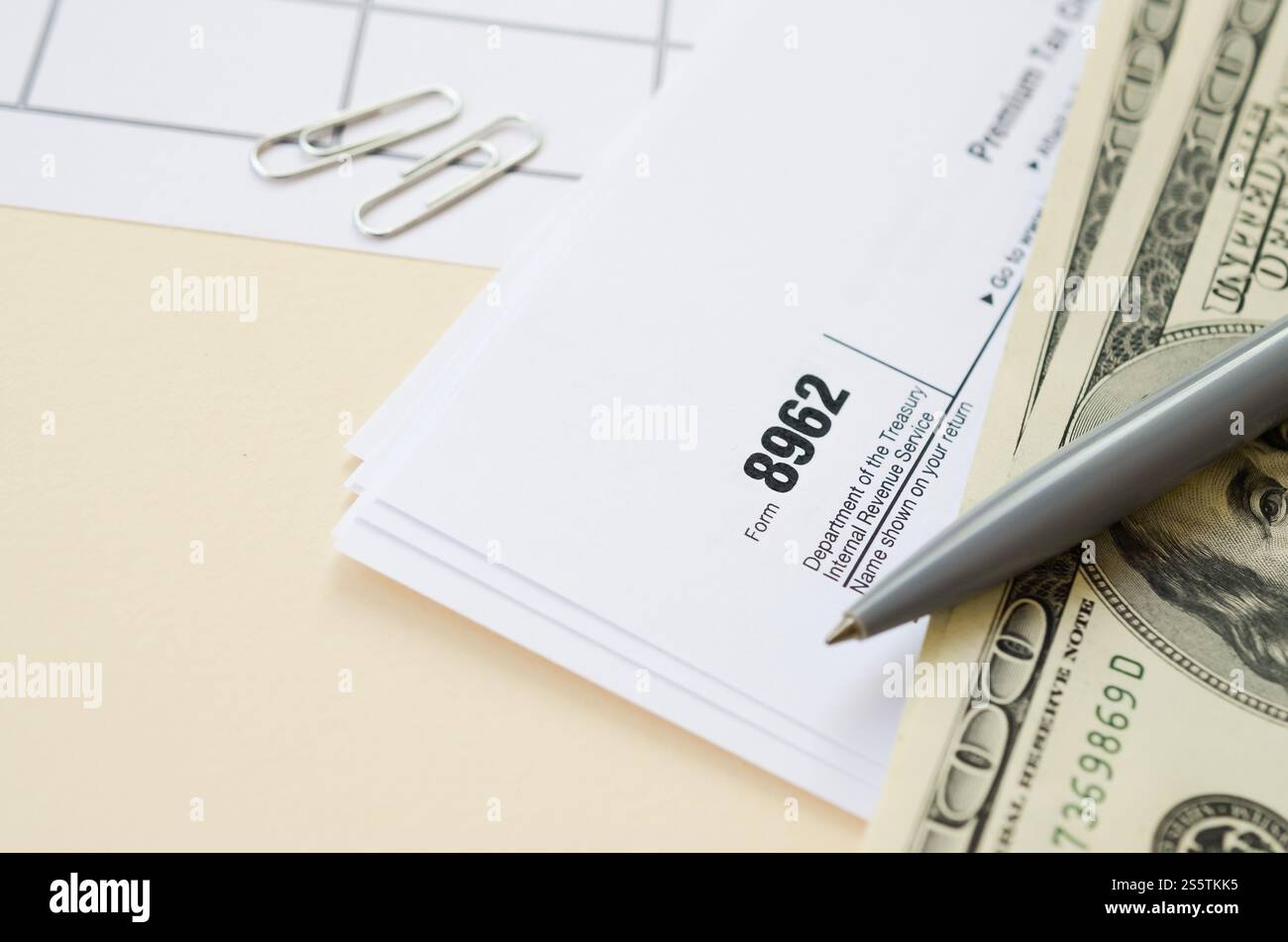 IRS Form 8962 Premium tax cerdit PTC blank lies with pen and many ...