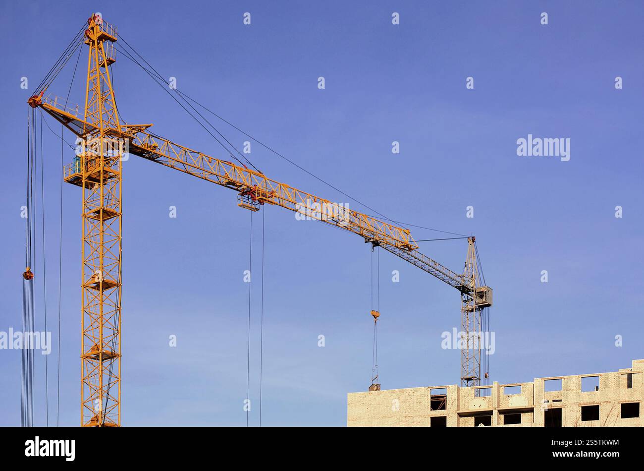 Working tall cranes inside place for with tall buildings under ...