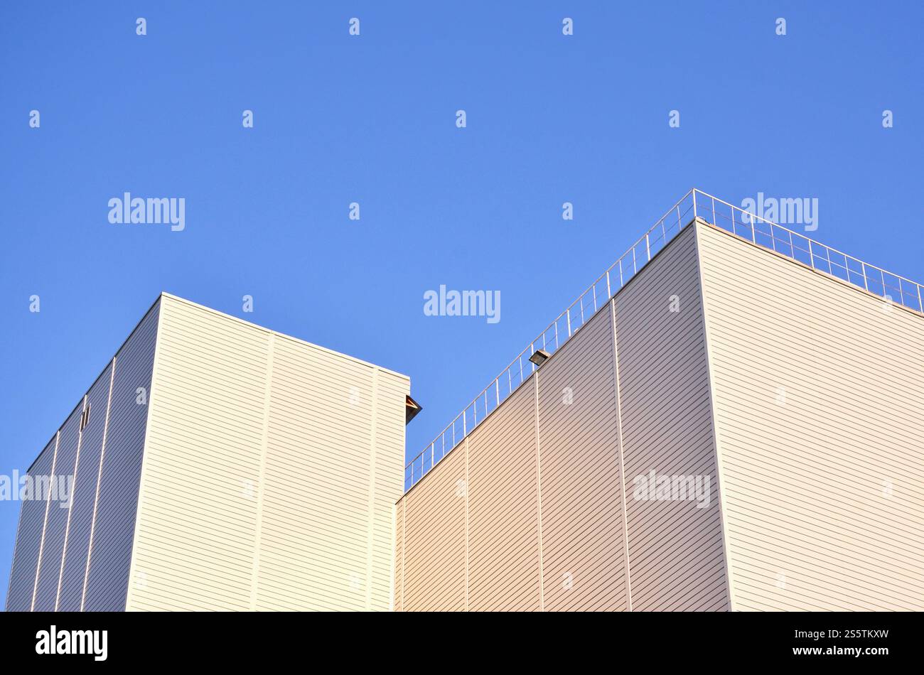 Photo of industrial high-rise building with perfect quality siding in ...