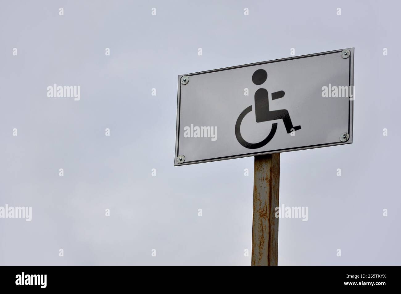 A road sign indicating the crossing of a road for disabled people ...