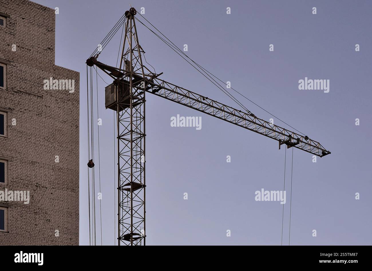 Working tall cranes inside place for with tall buildings under ...