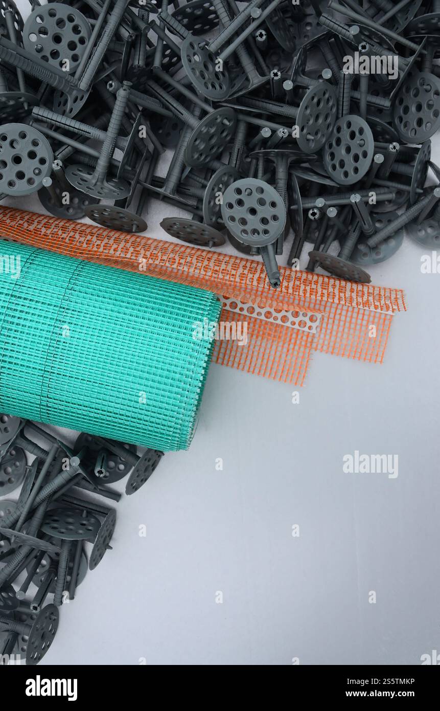 A set of construction items for the insulation of walls. Plastic dowels ...