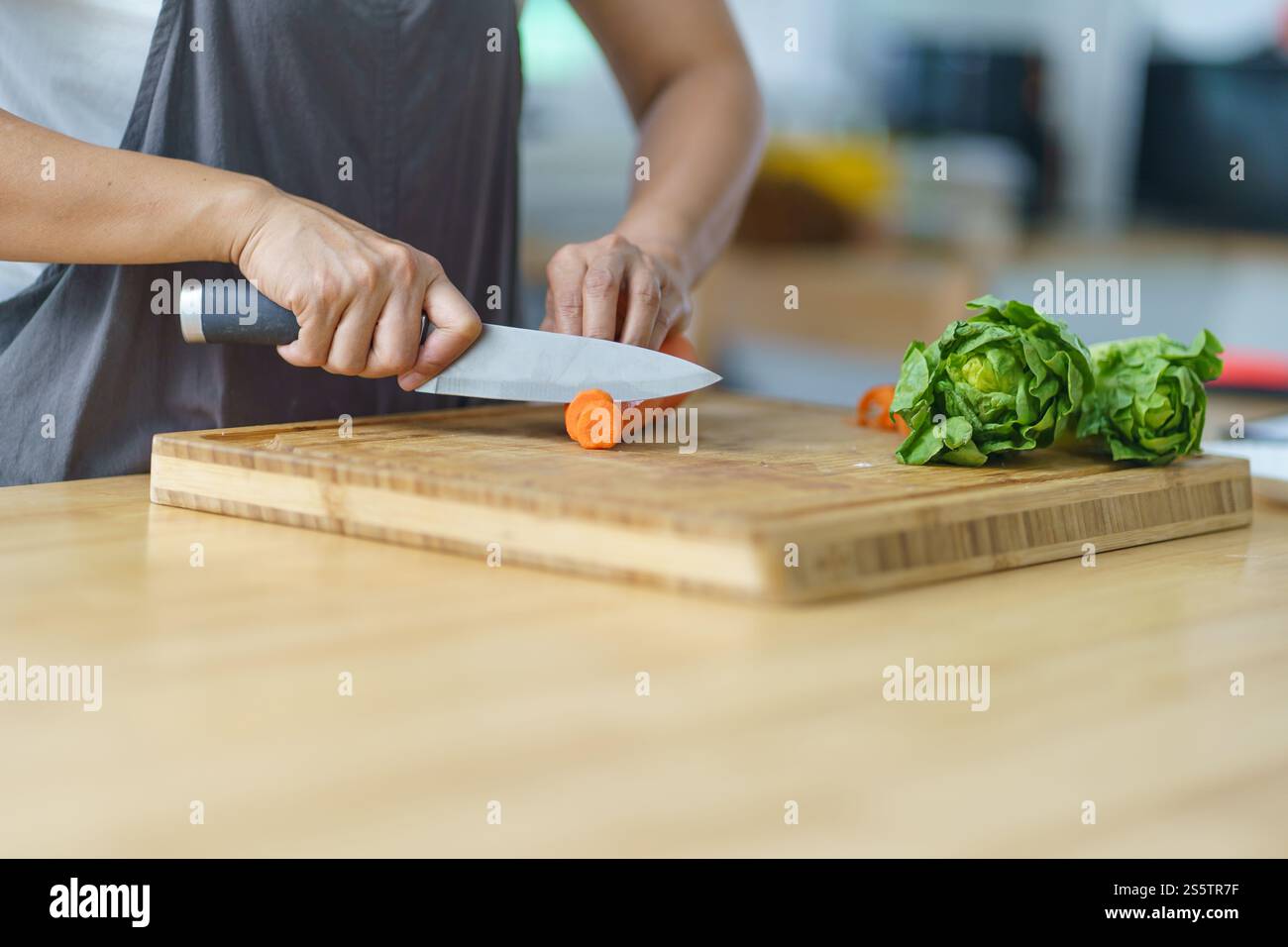 Prepare food woman is preparing vegetable salad in the kitchen Healthy ...