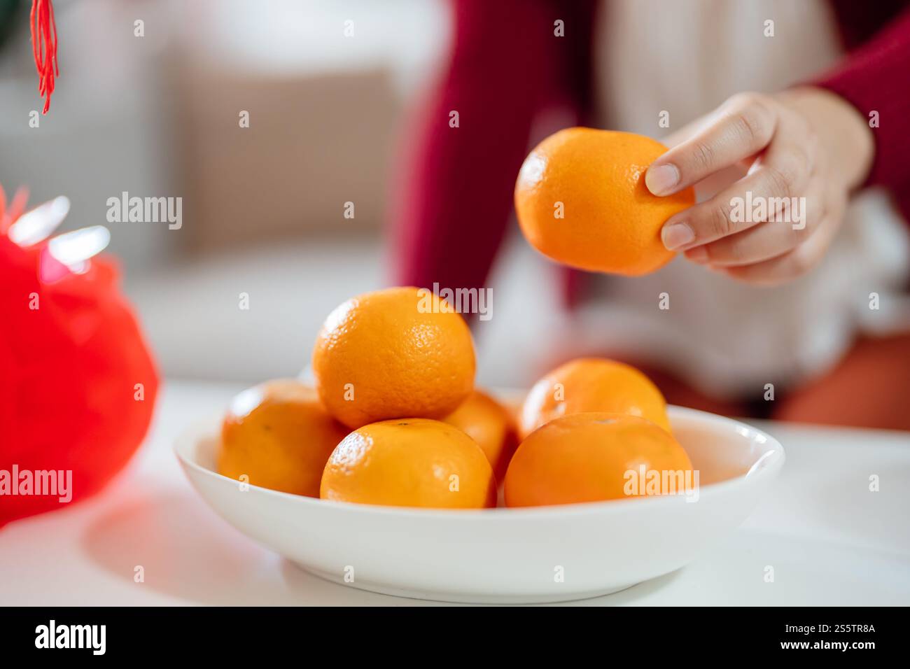 Asian Woman holding mandarin oranges with red gift box thankful present ...