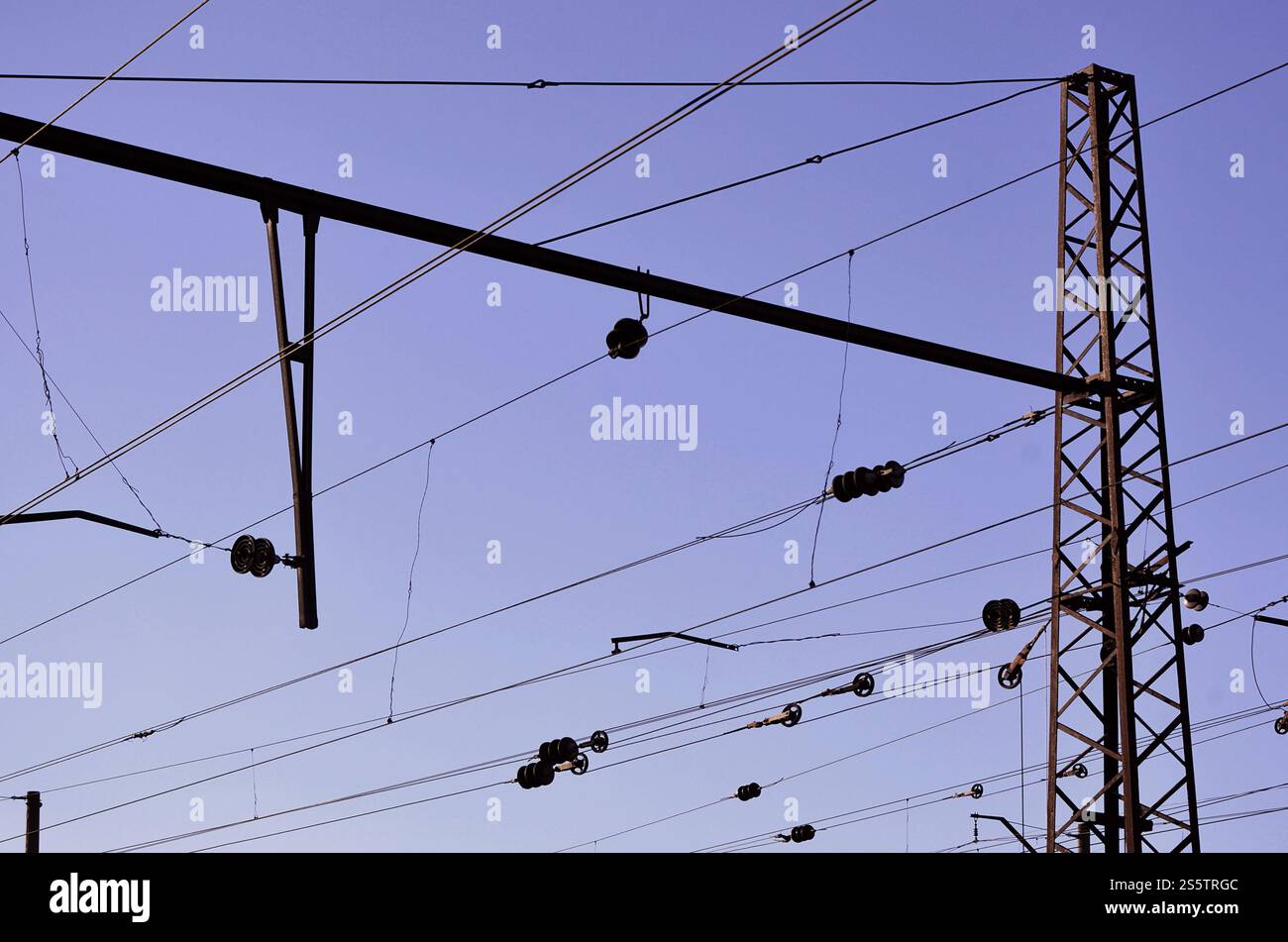 Railroad overhead lines against clear blue sky, Contact wire. High ...