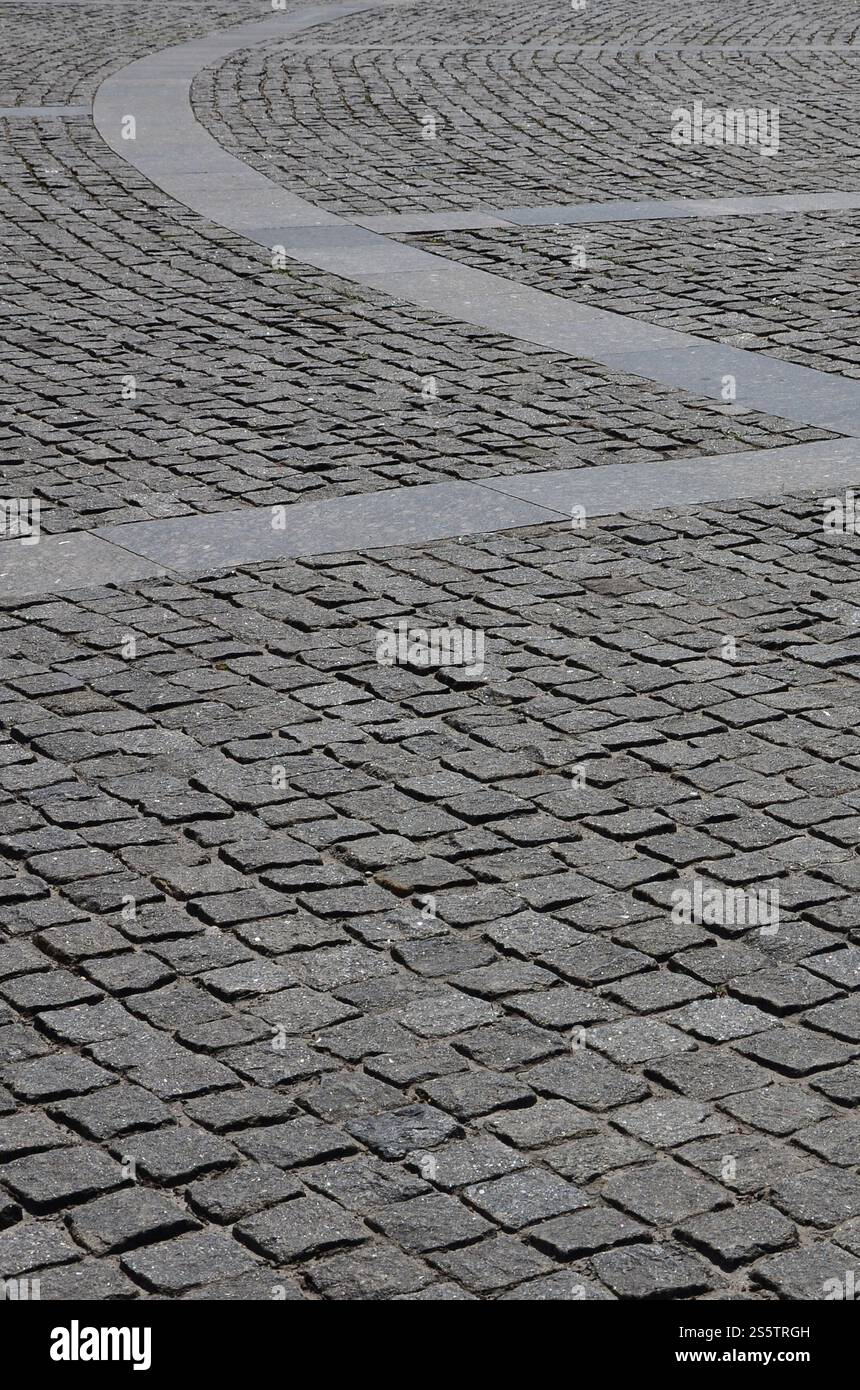 The texture of the paving slab (paving stones) of many small stones of ...