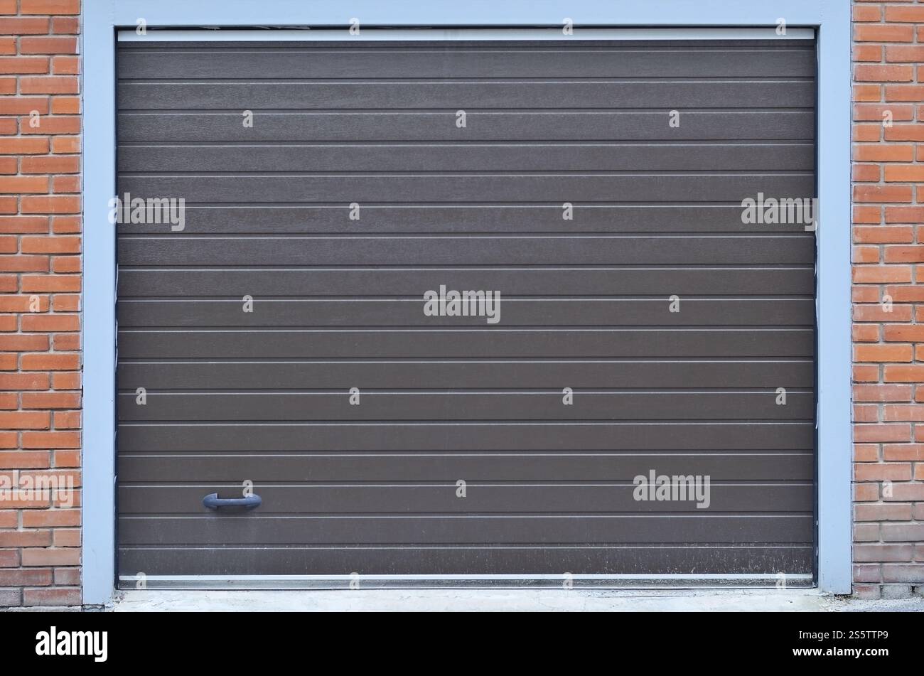 The texture of brown shutter door or rolling door in the red brick wall ...