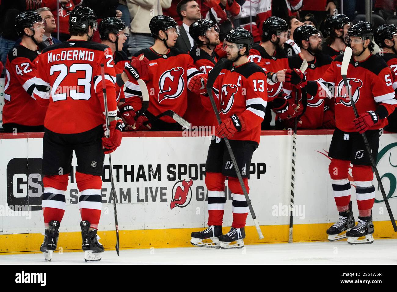 New Jersey Devils center Nico Hischier (13), center, celebrates with ...