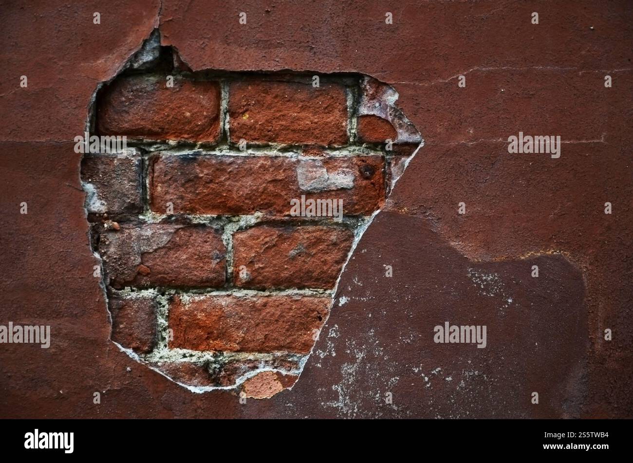 Weathered stained brick wall with cracked cement tension. Brick wall ...