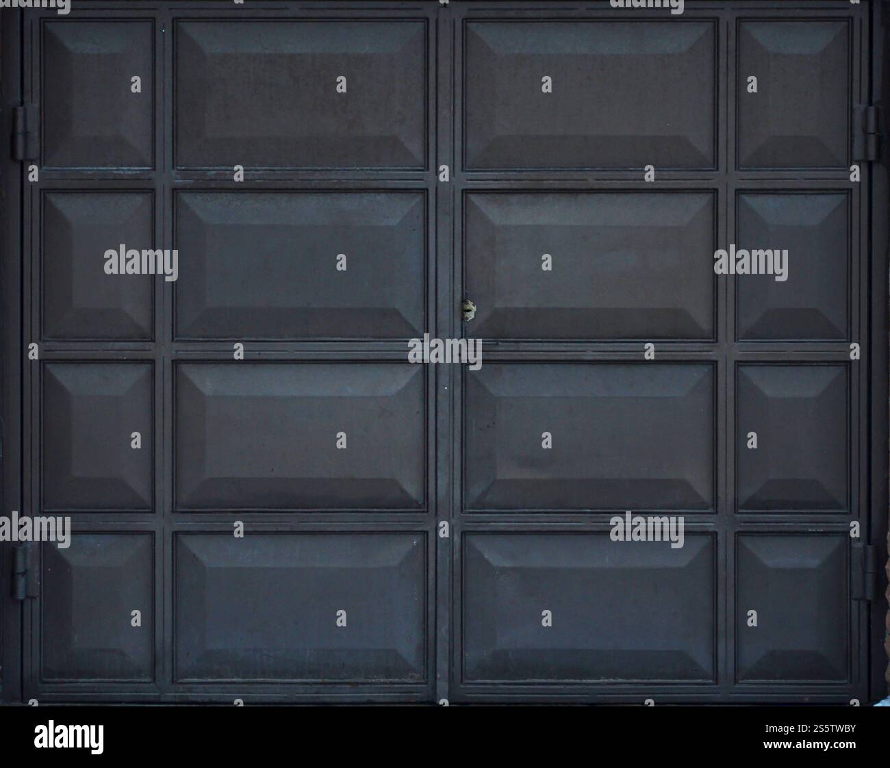 The texture of brown corrugated metal door with a colored frame. The ...