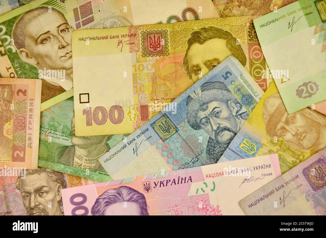 Many Ukrainian money bills of various denominations and colors ...