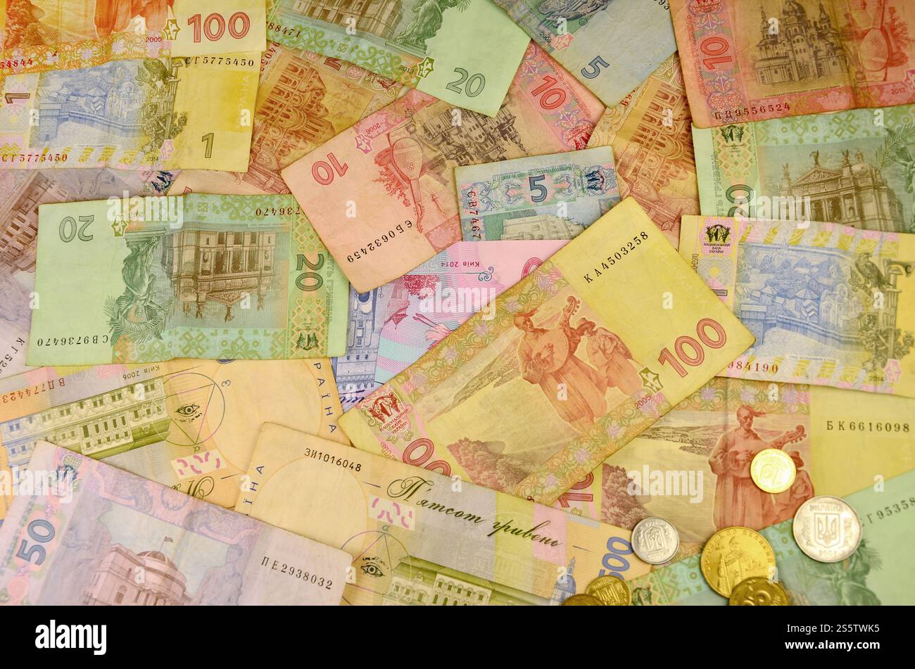 Background image of many Ukrainian banknotes of different colors and ...