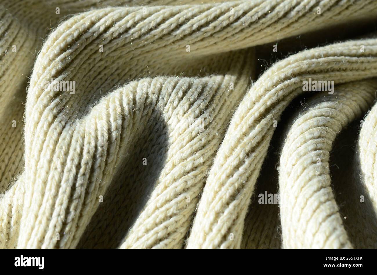 Fabric texture of a soft yellow knitted sweater. Macro image of the ...
