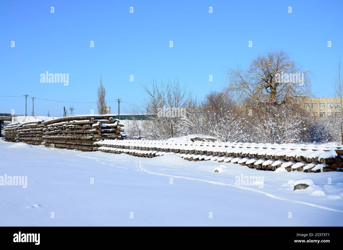 A lot of old rails and sleepers are stacked in a railway warehouse in ...
