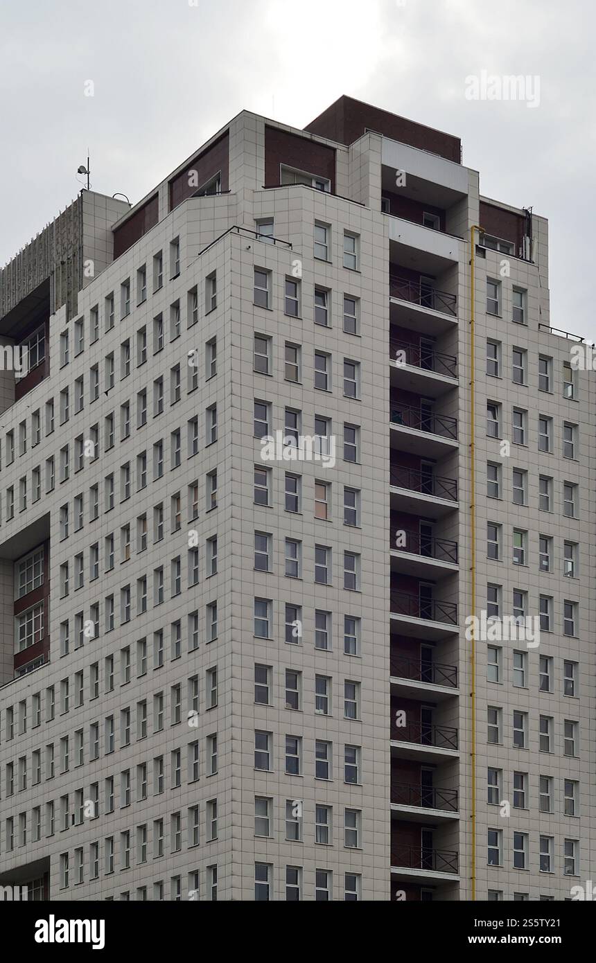 Multi-story office building beige color with lots of glass windows on a ...