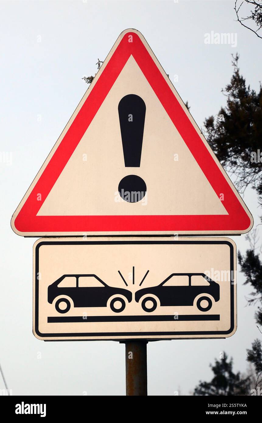 High risk of collision. A road sign with an exclamation point and two ...