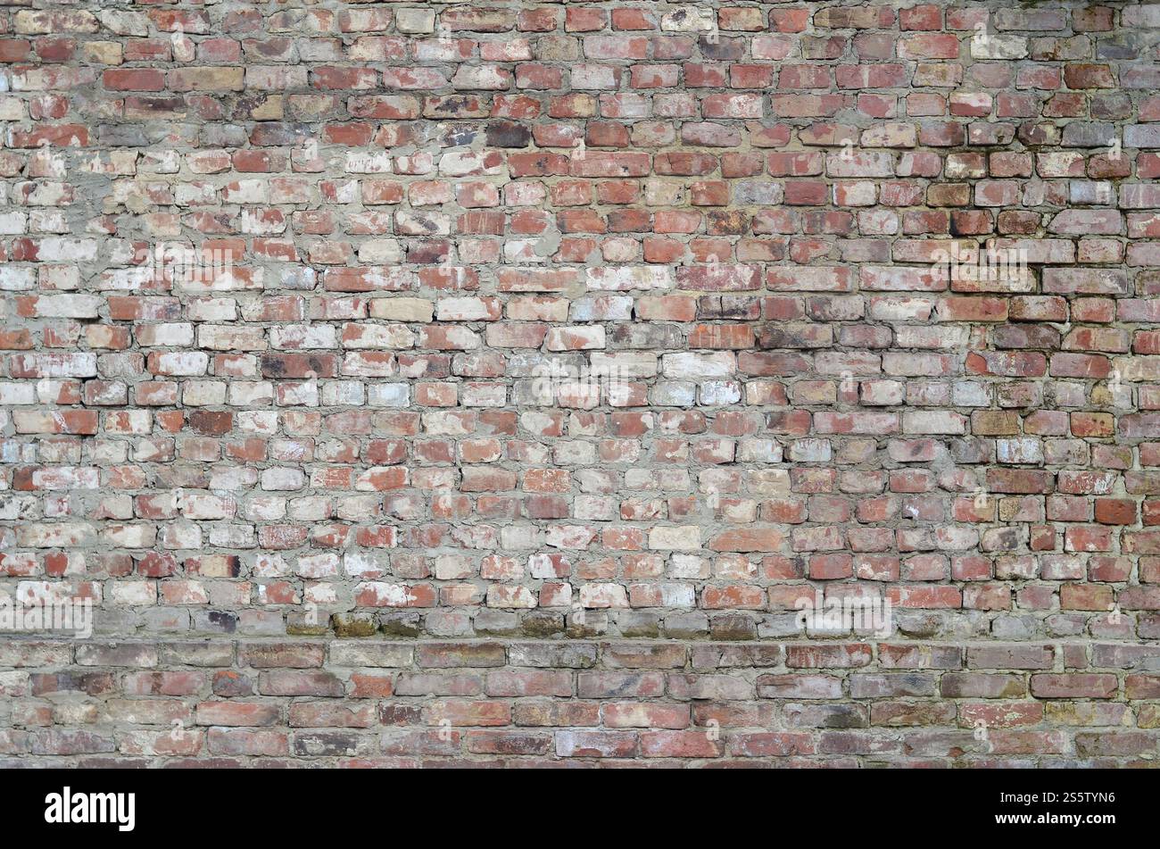 Weathered stained old brick wall background. Texture of an old red wall ...