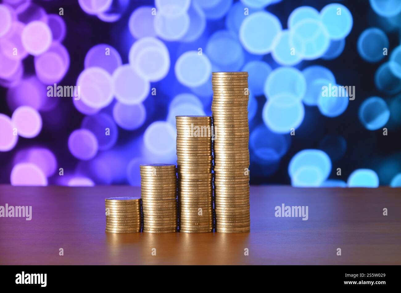 Golden coin stacks arranged as a graph. Increasing columns of coins ...