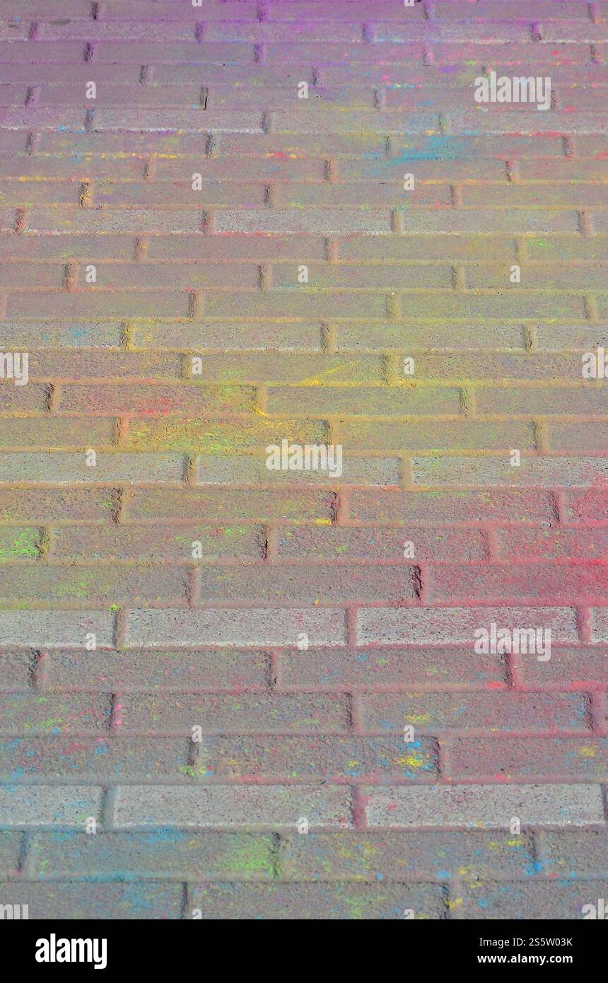 Multi colored earth, paving slabs, powder coated with dry colors at the Holi festival close up ...