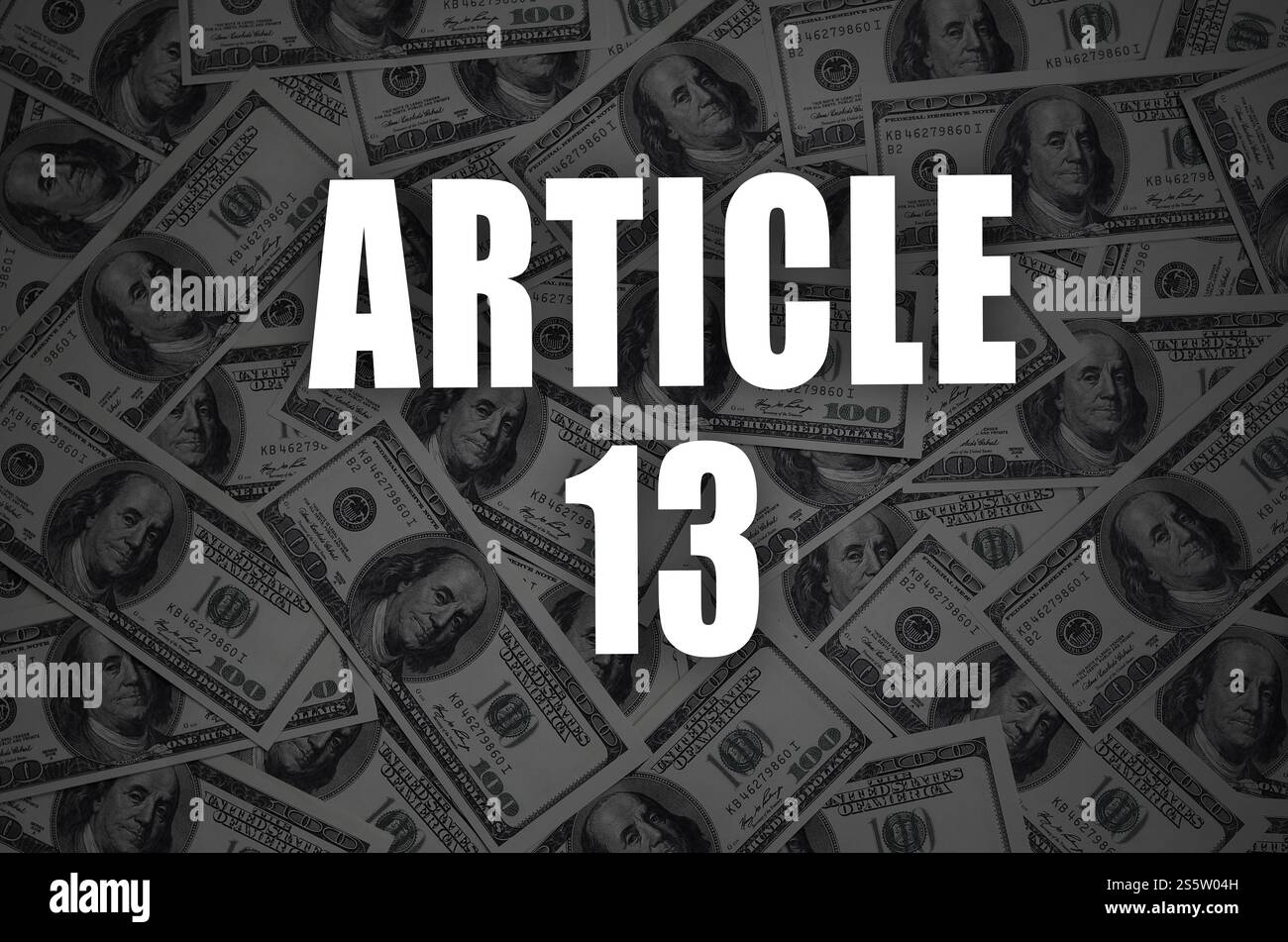 Article 13 inscription and many hundred dollar bills in dark background ...