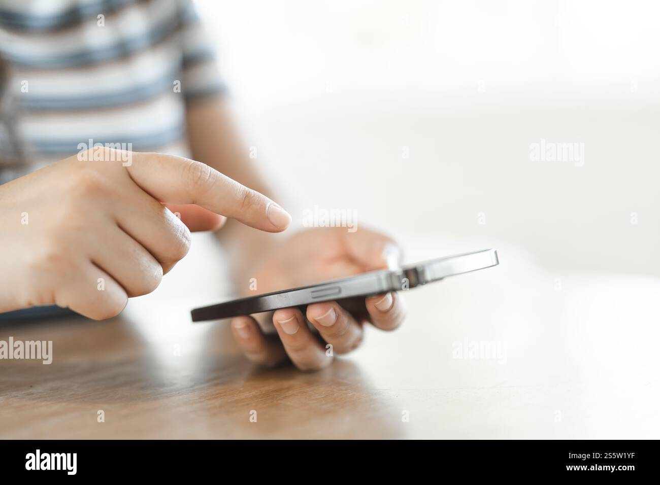 Womens Hands holding cell telephone working mobile devices. smart phone ...