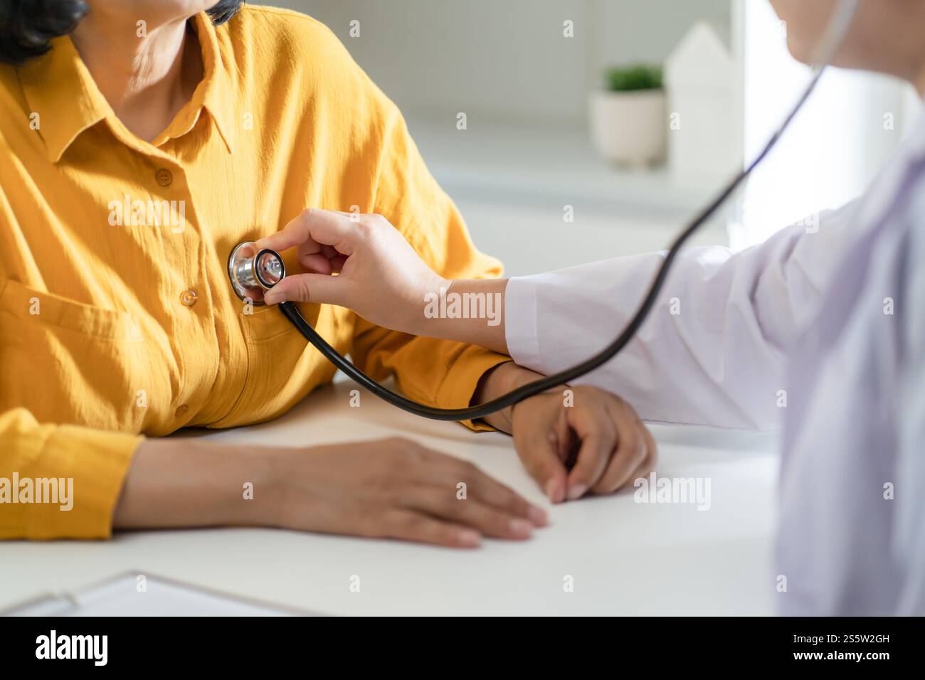 Doctor using a stethoscope checking patient stethoscope putting beat ...