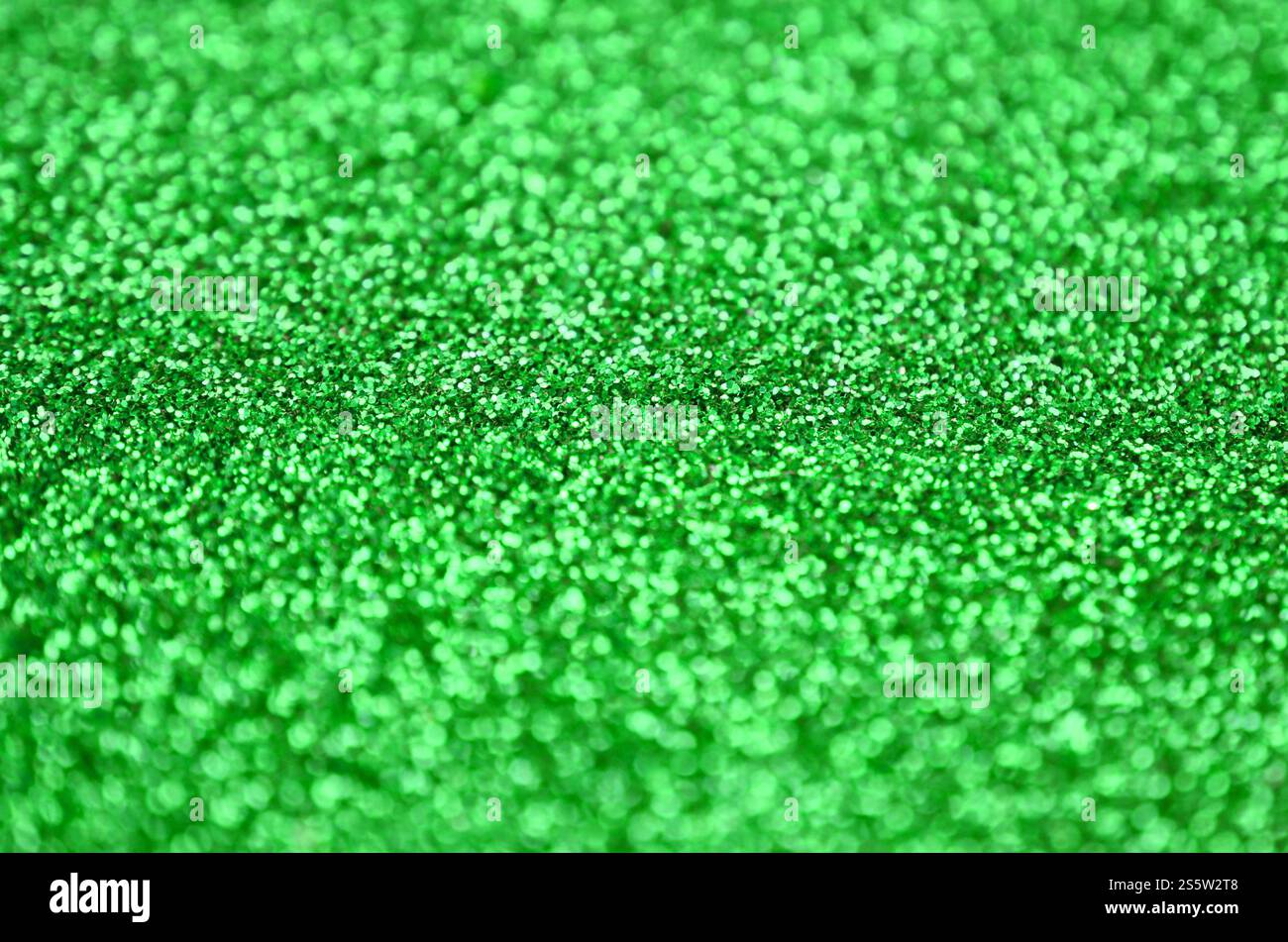 A huge amount of green decorative sequins. Background image with shiny ...