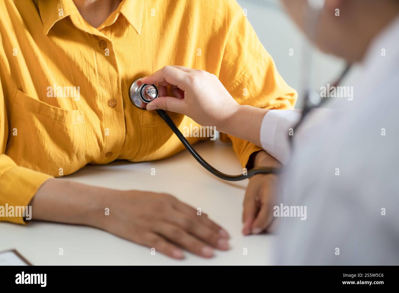 Doctor using a stethoscope checking patient stethoscope putting beat ...