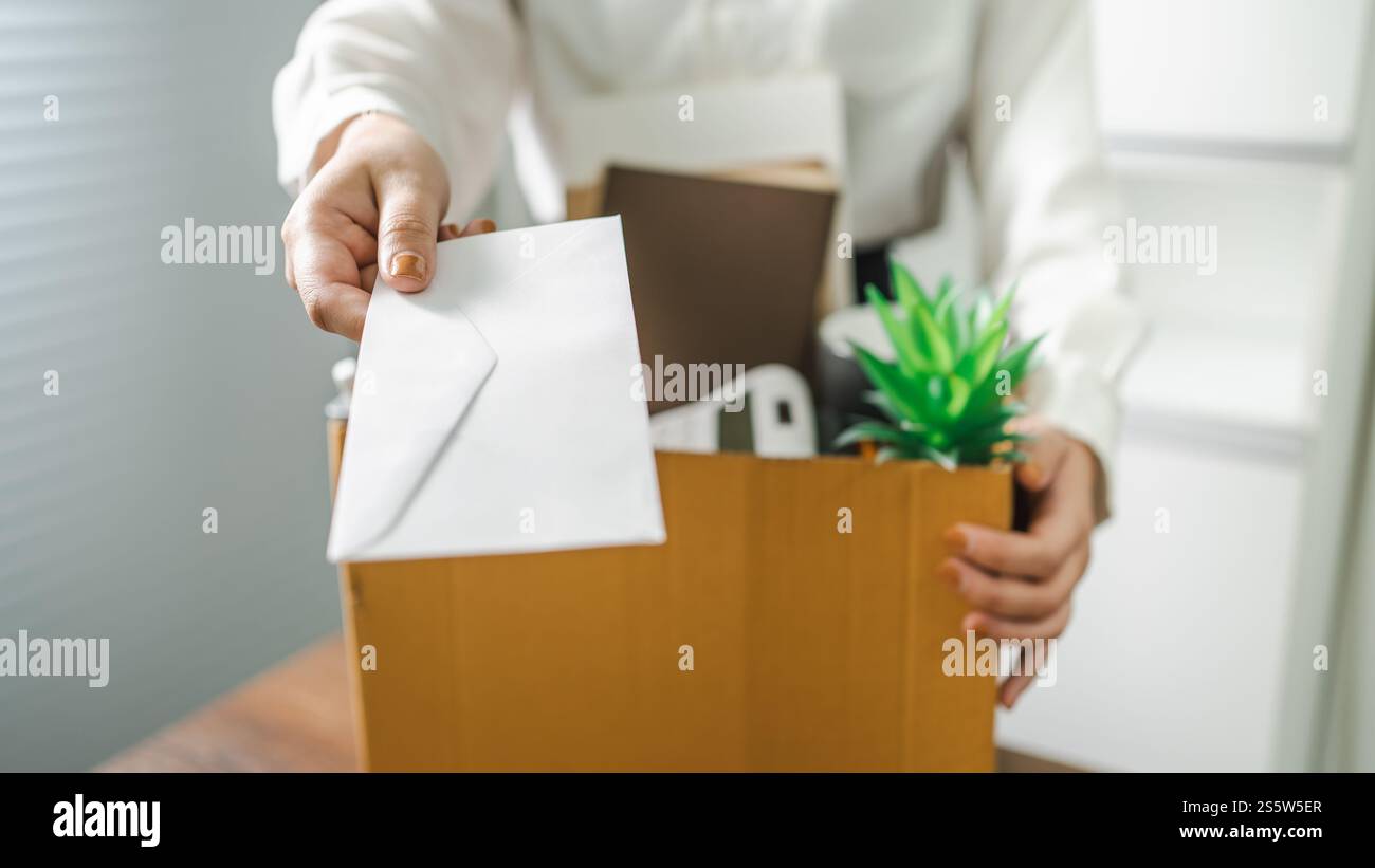 Business woman sending resignation letter and packing Stuff Resign ...