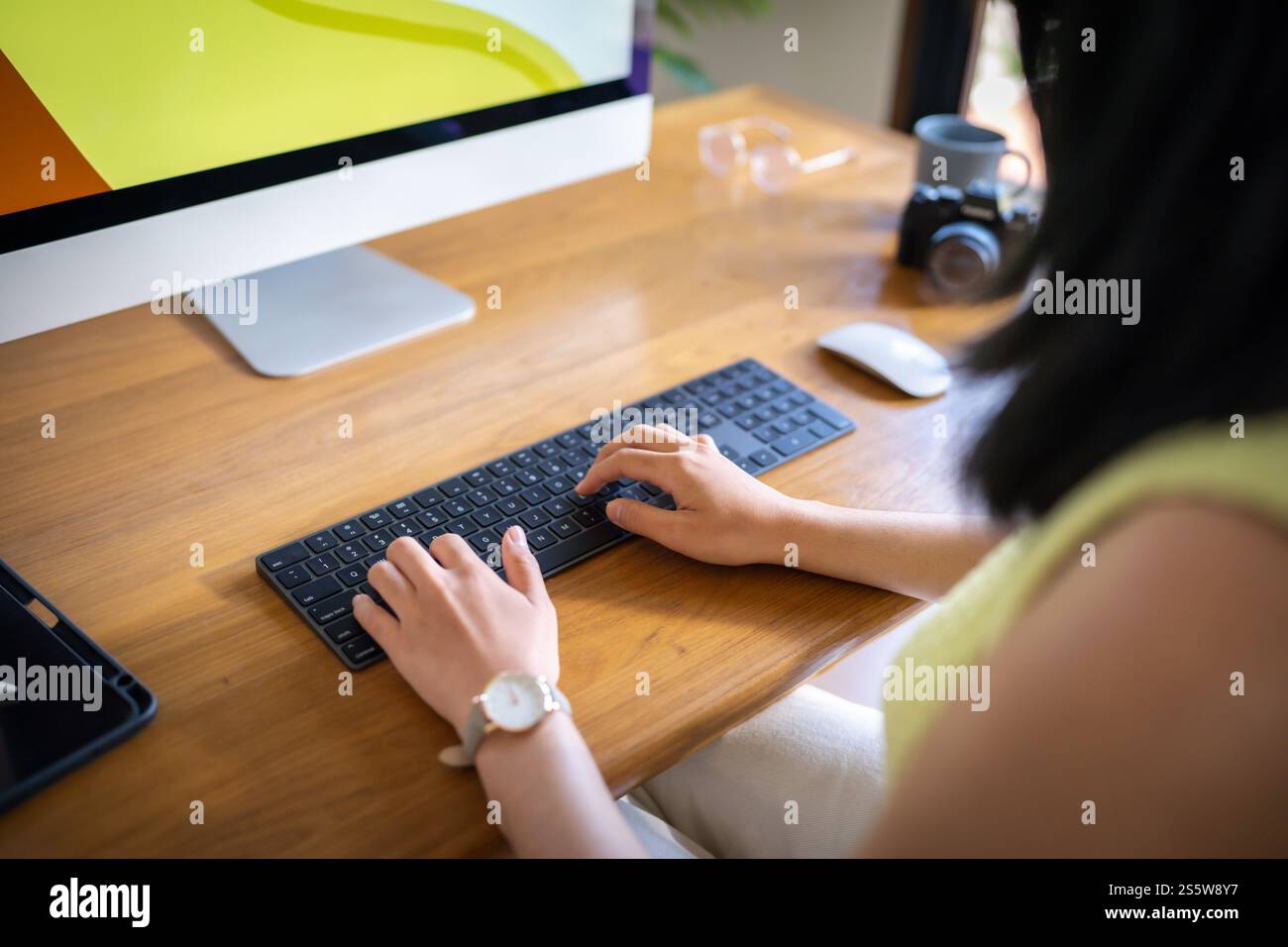Graphic designer working on digital tablet and computer. Designer Asian ...