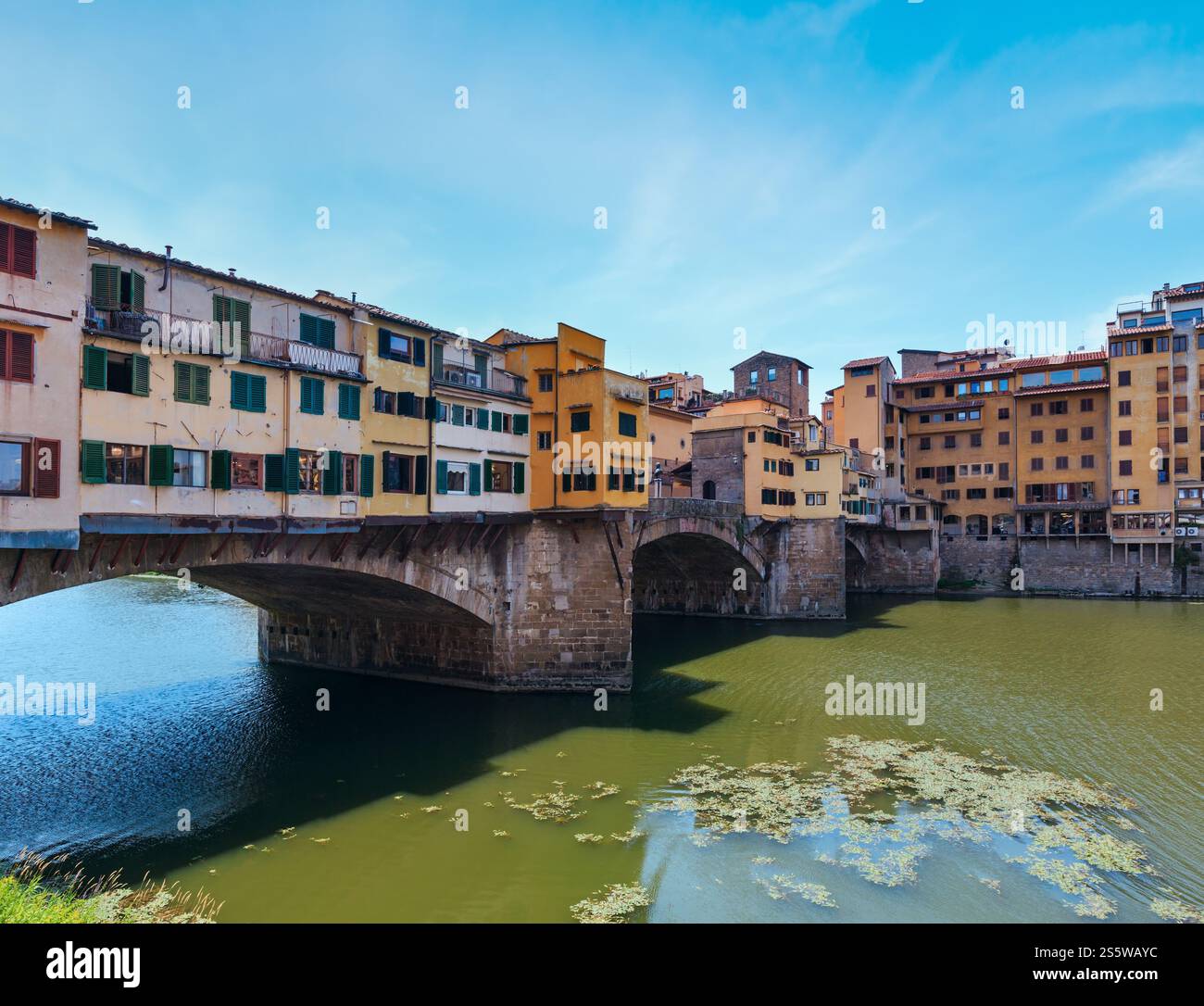 Medieval stone closed-spandrel segmental arch bridge Ponte Vecchio over ...