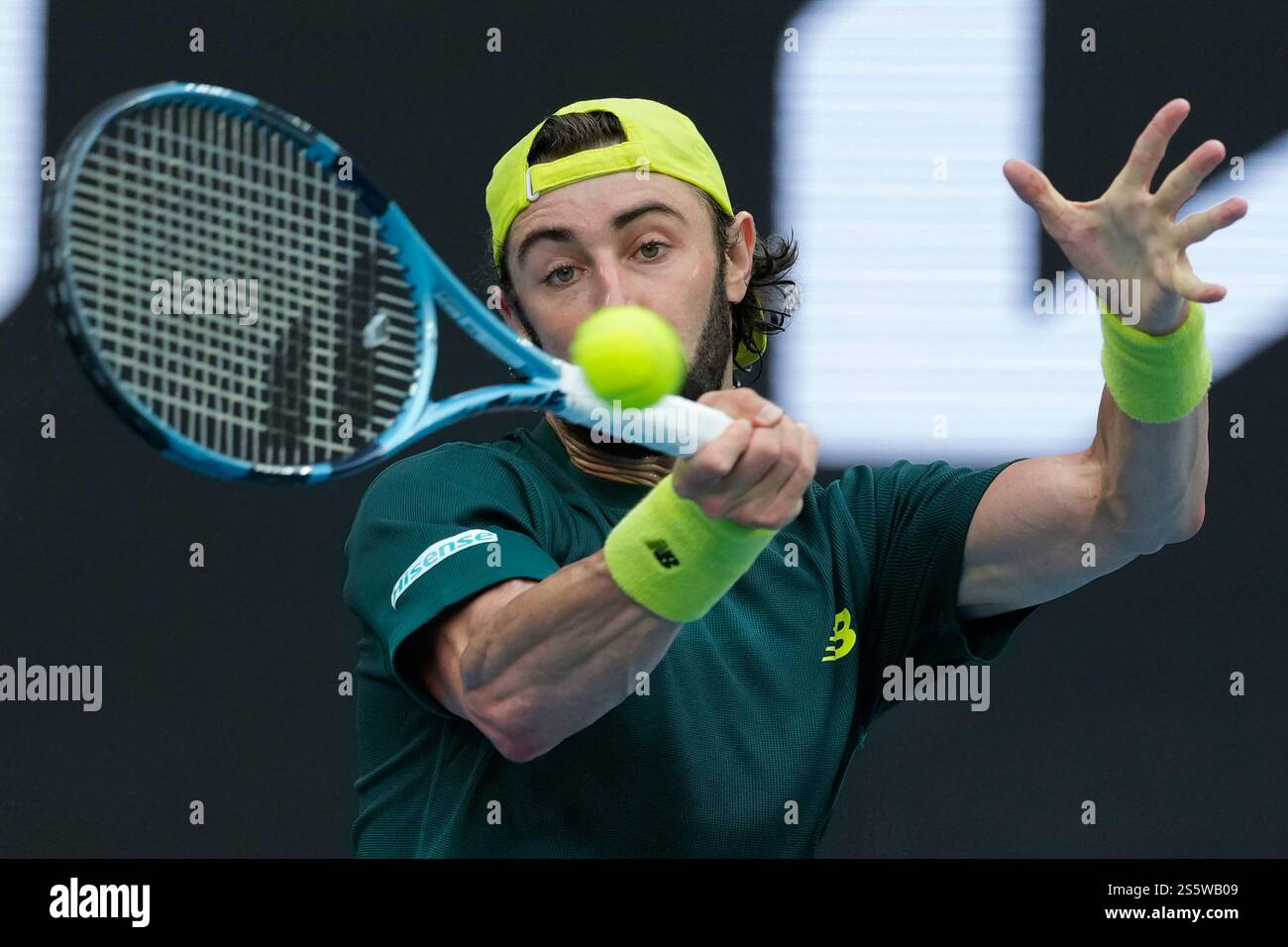 Jordan Thompson of Australia plays a forehand return to Nuno Borges of ...