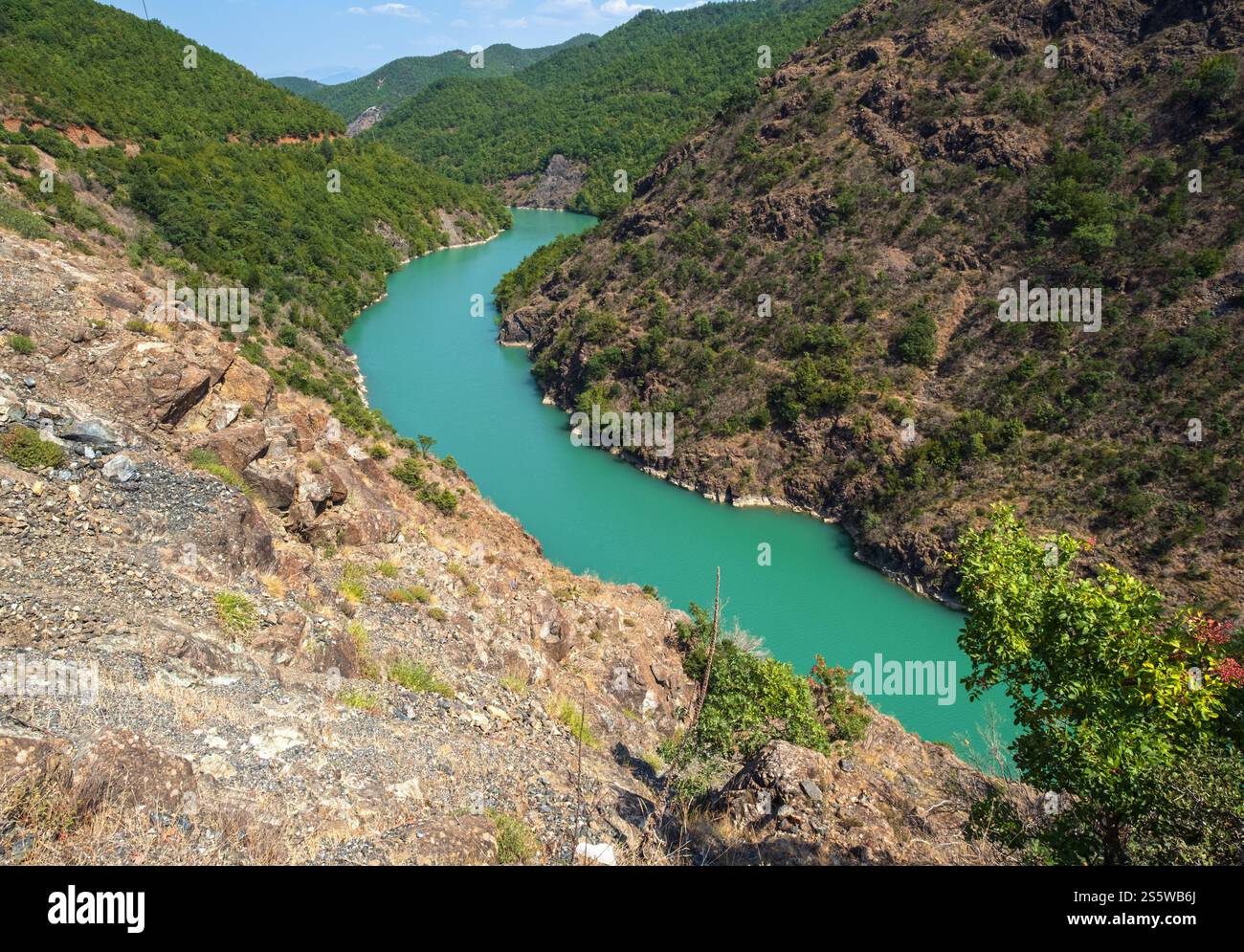 Road along emerald water lake hi-res stock photography and images - Alamy