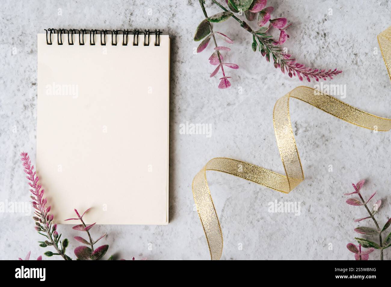 notebook, ribbon and flower is placed on white background Stock Photo ...