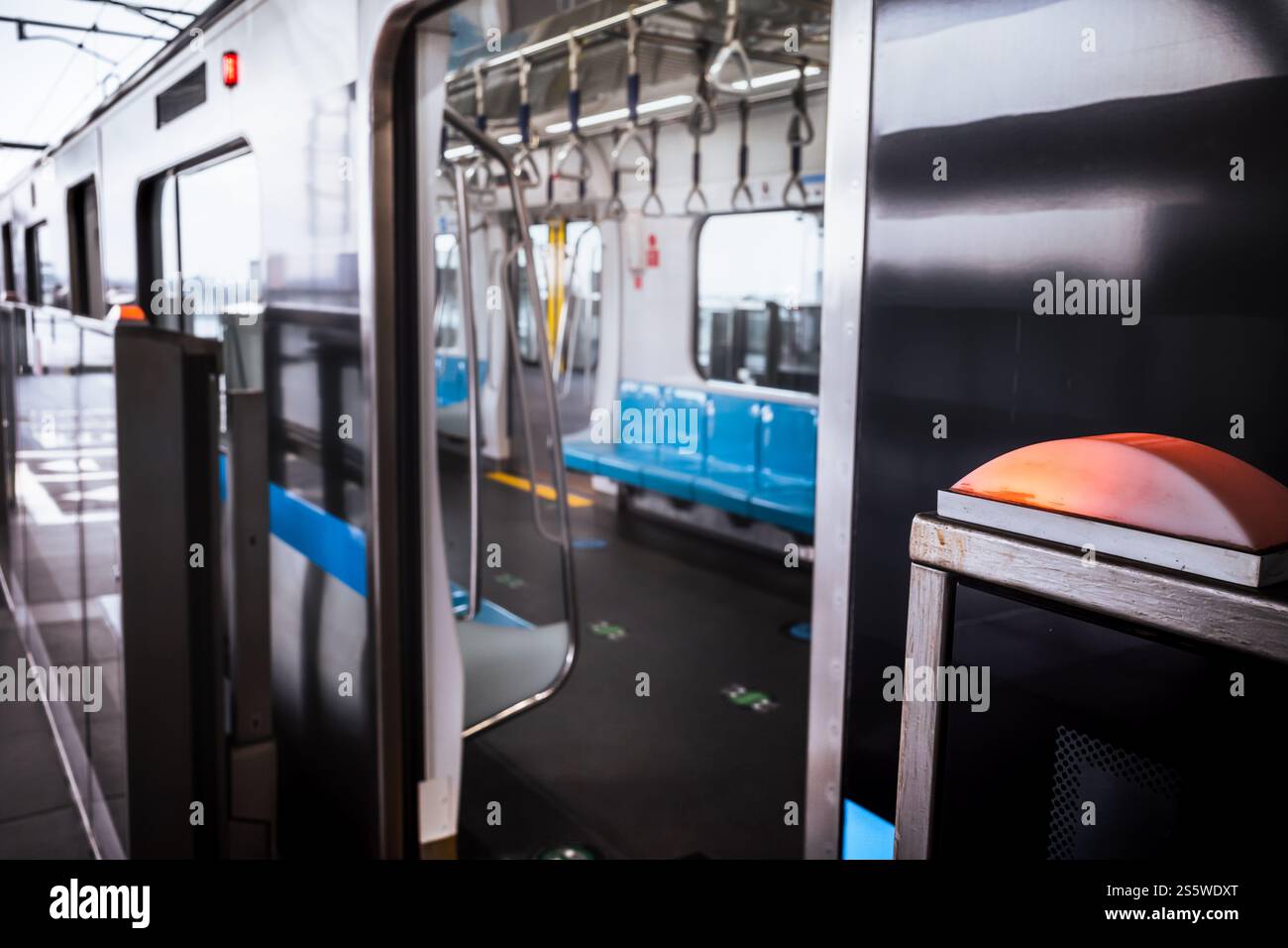 Entrance door of a subway commuter train open at station platform ...