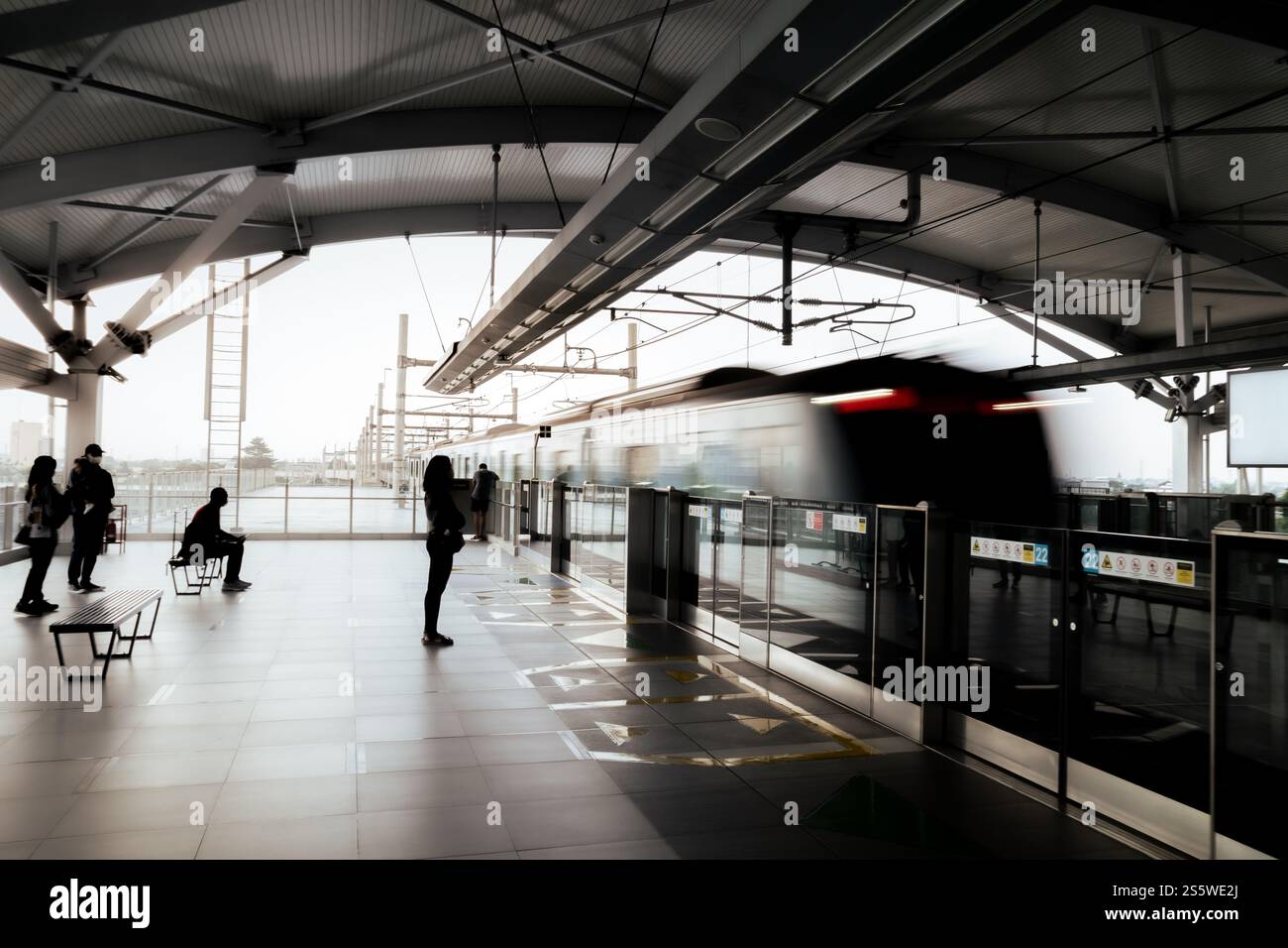 Subway train station platform with passengers waiting Stock Photo - Alamy