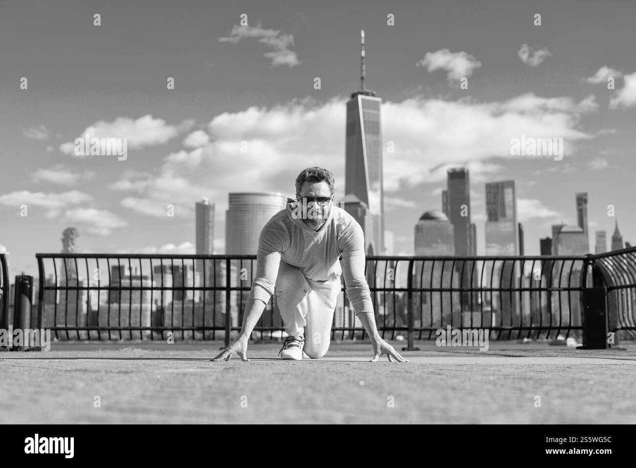 Sport runner at the start. Sprinter leaving starting on running track ...