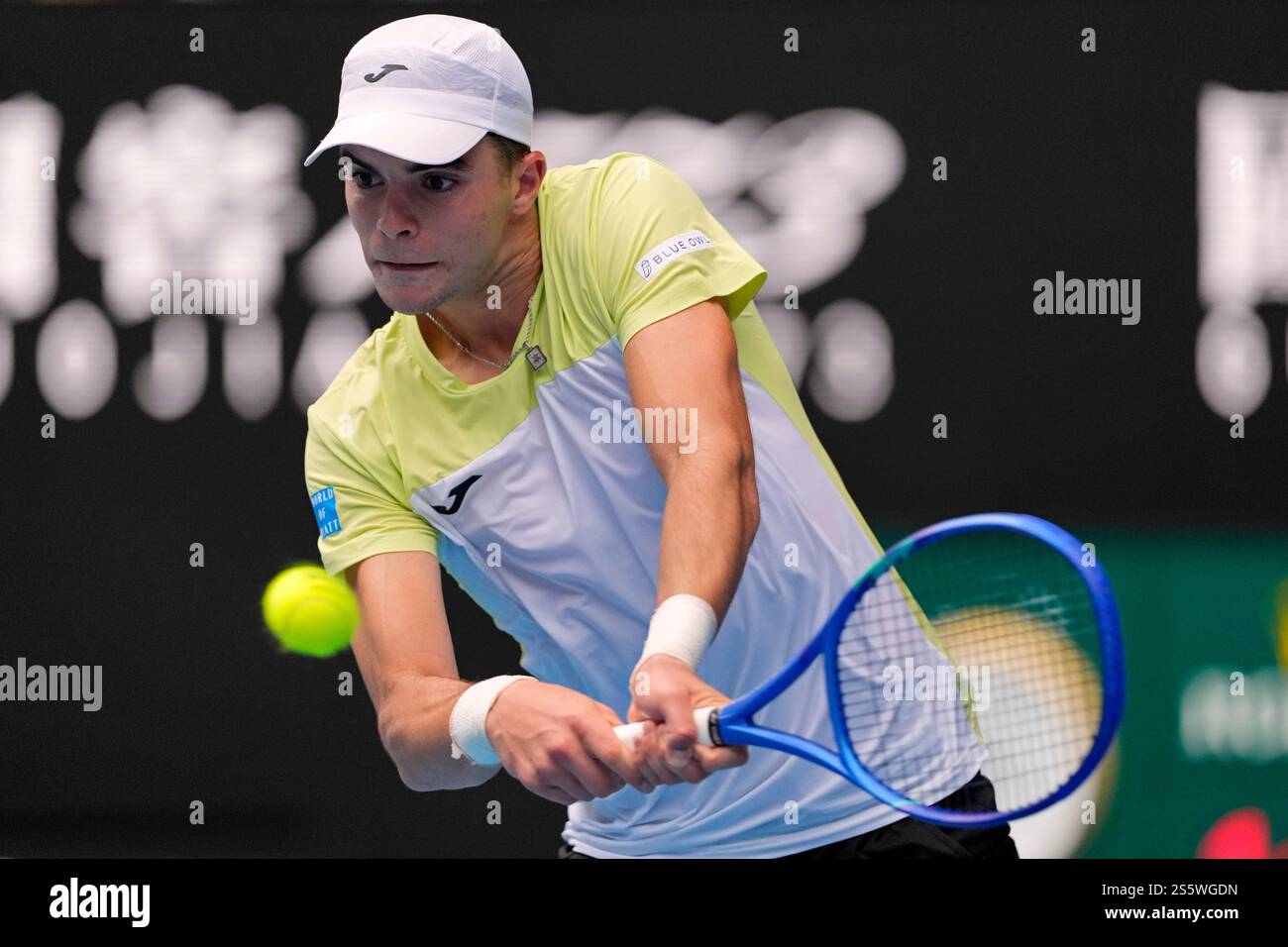 Jaime Faria of Portugal plays a backhand return to Novak Djokovic of ...