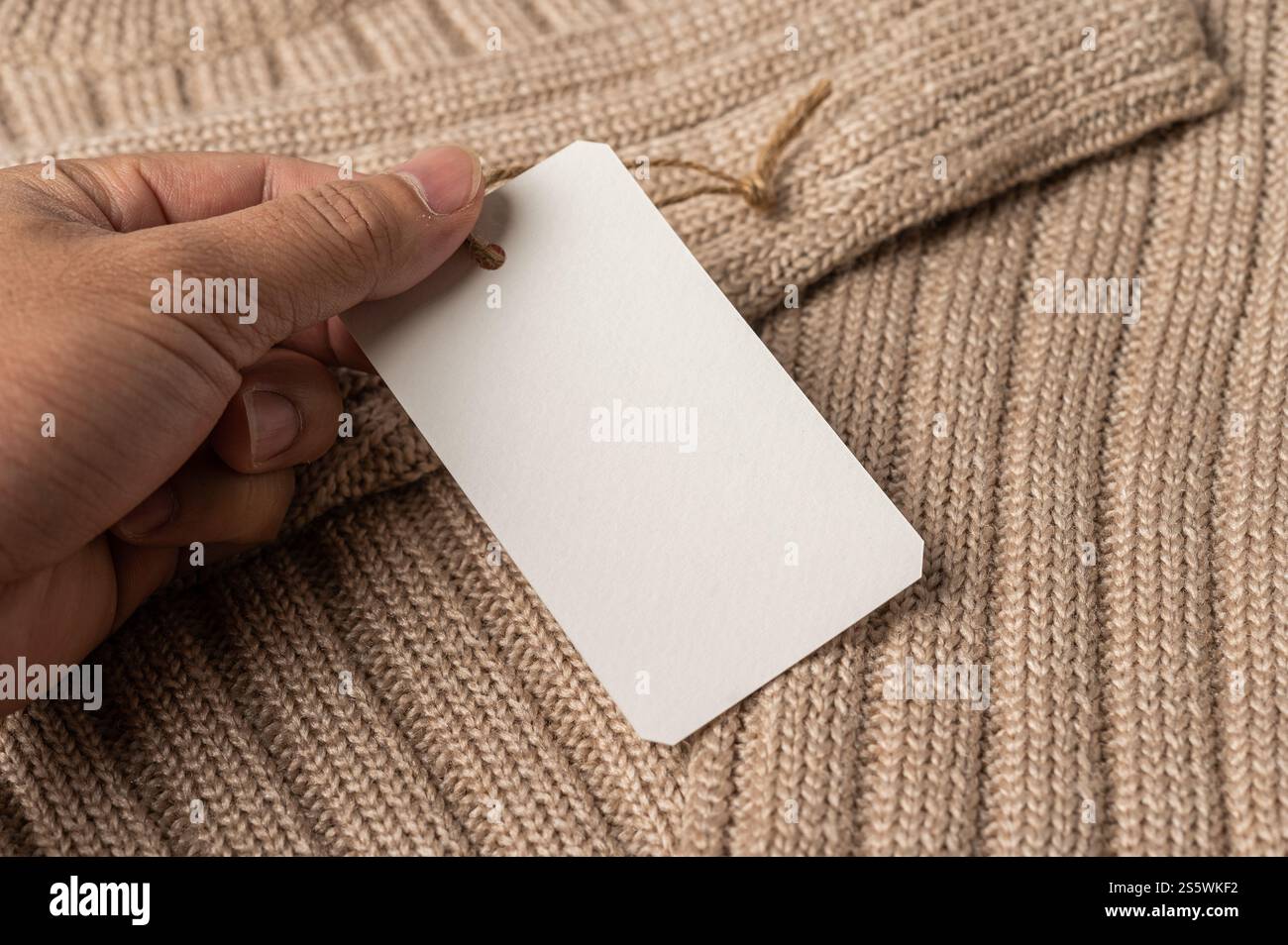 Hand and blank paper label on shirt hi-res stock photography and images ...