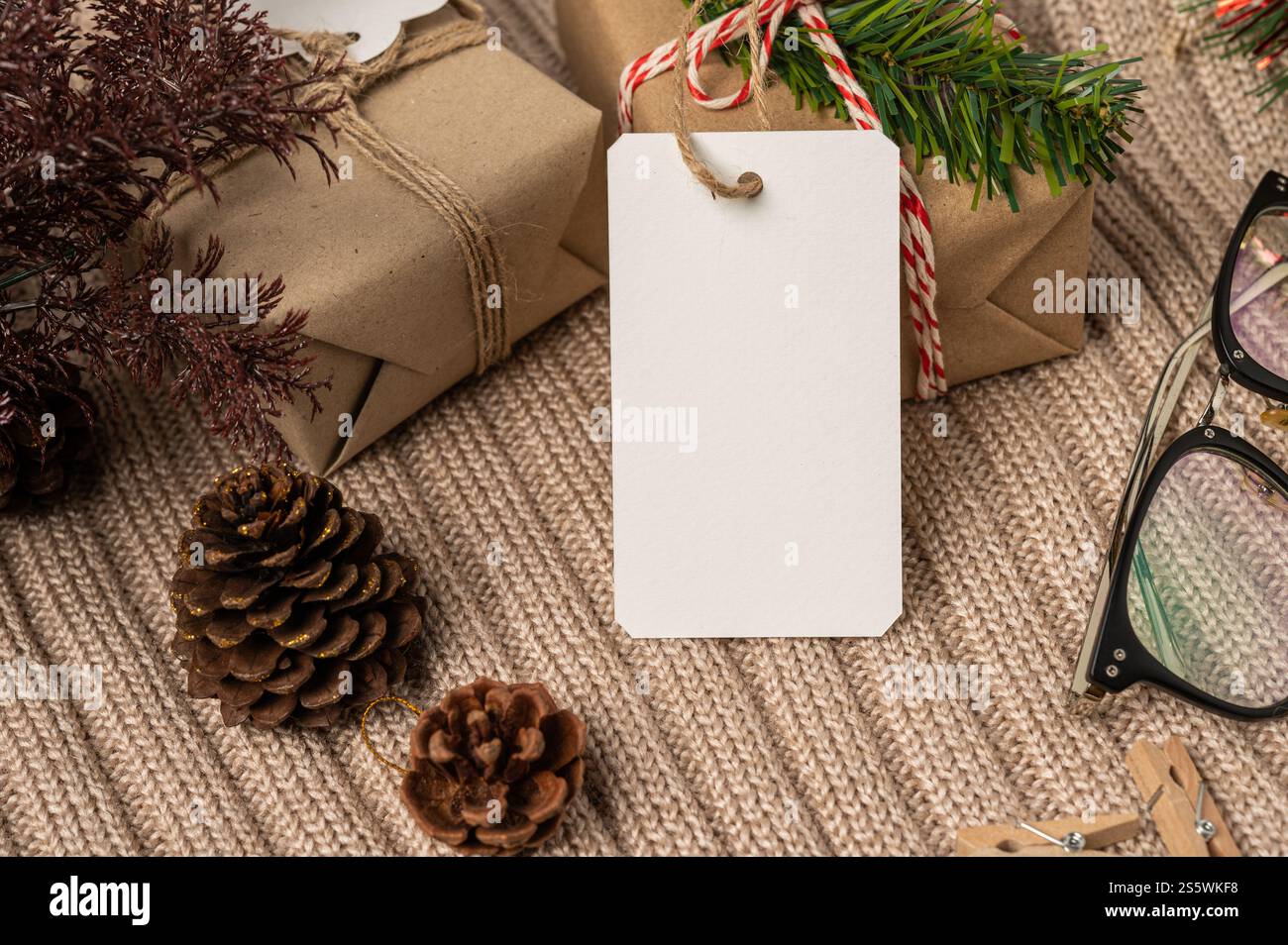 clear tag and gift box on the sweater Stock Photo - Alamy