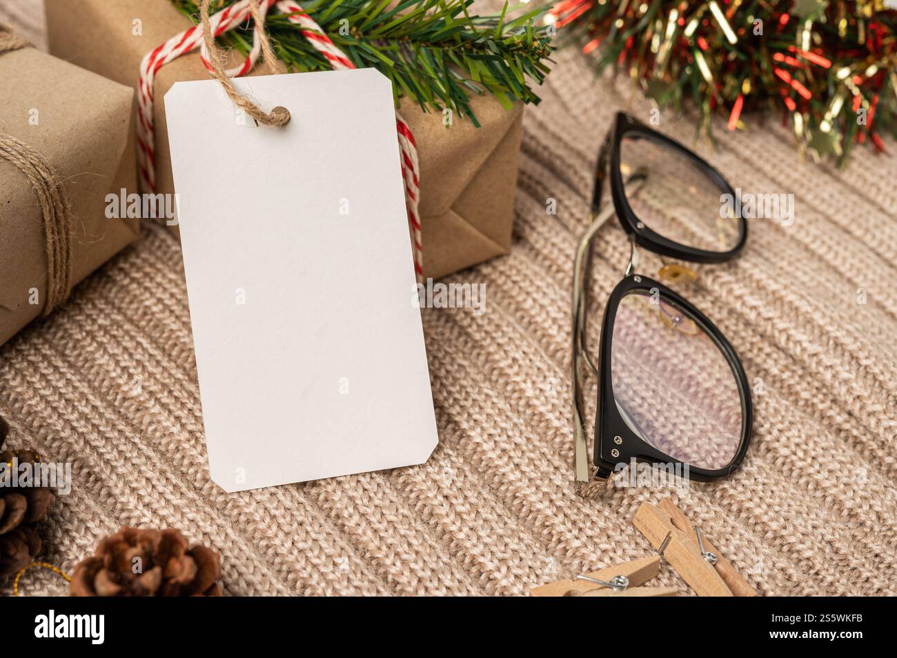 clear tag and gift box on the sweater Stock Photo - Alamy