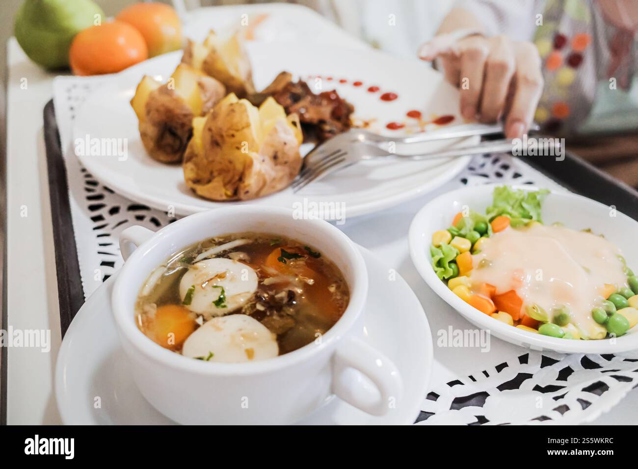 Woman patient at hospital reach her healthy diet meals menu served on a ...