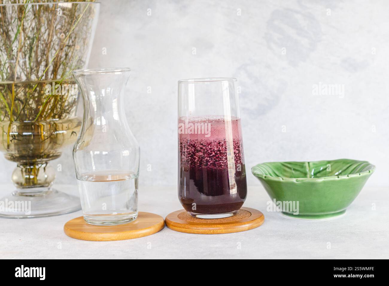 Decorated table for serving water and beet juice with beautiful flower ...
