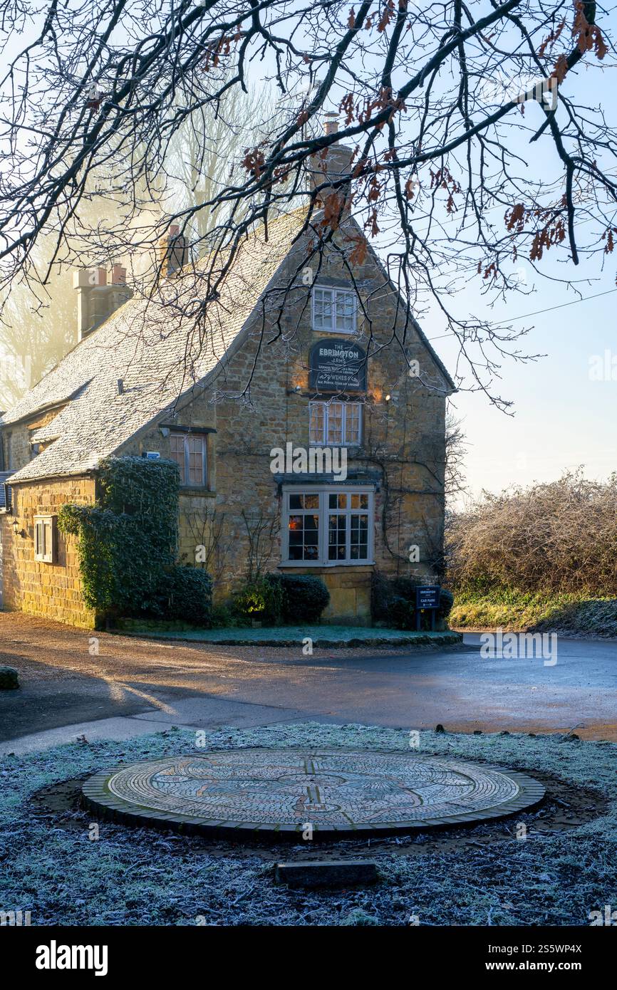 The Ebrington Arms and milenium sundial on a frosty winter morning ...