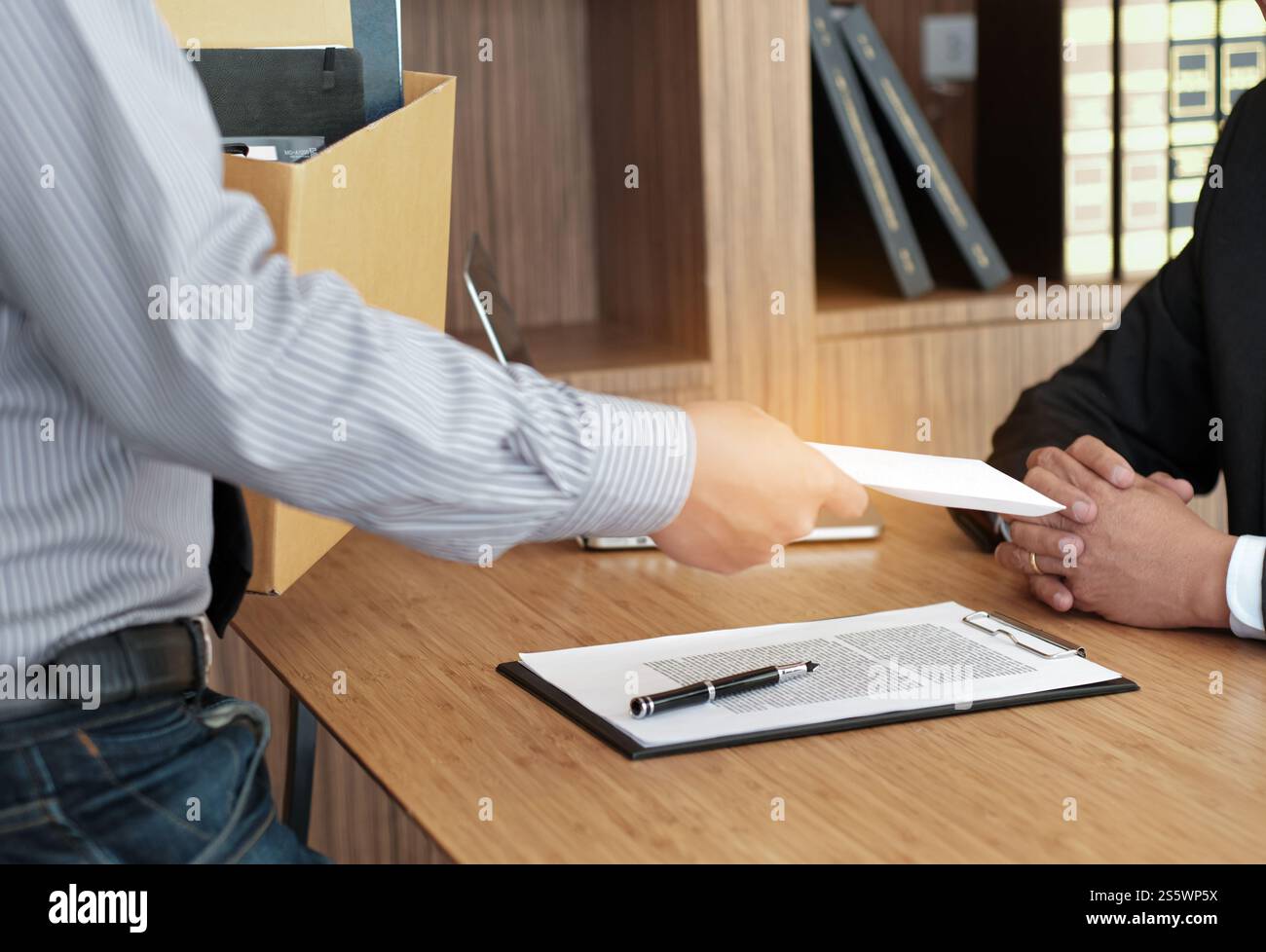 Business man sending resignation letter to boss and Holding Stuff ...