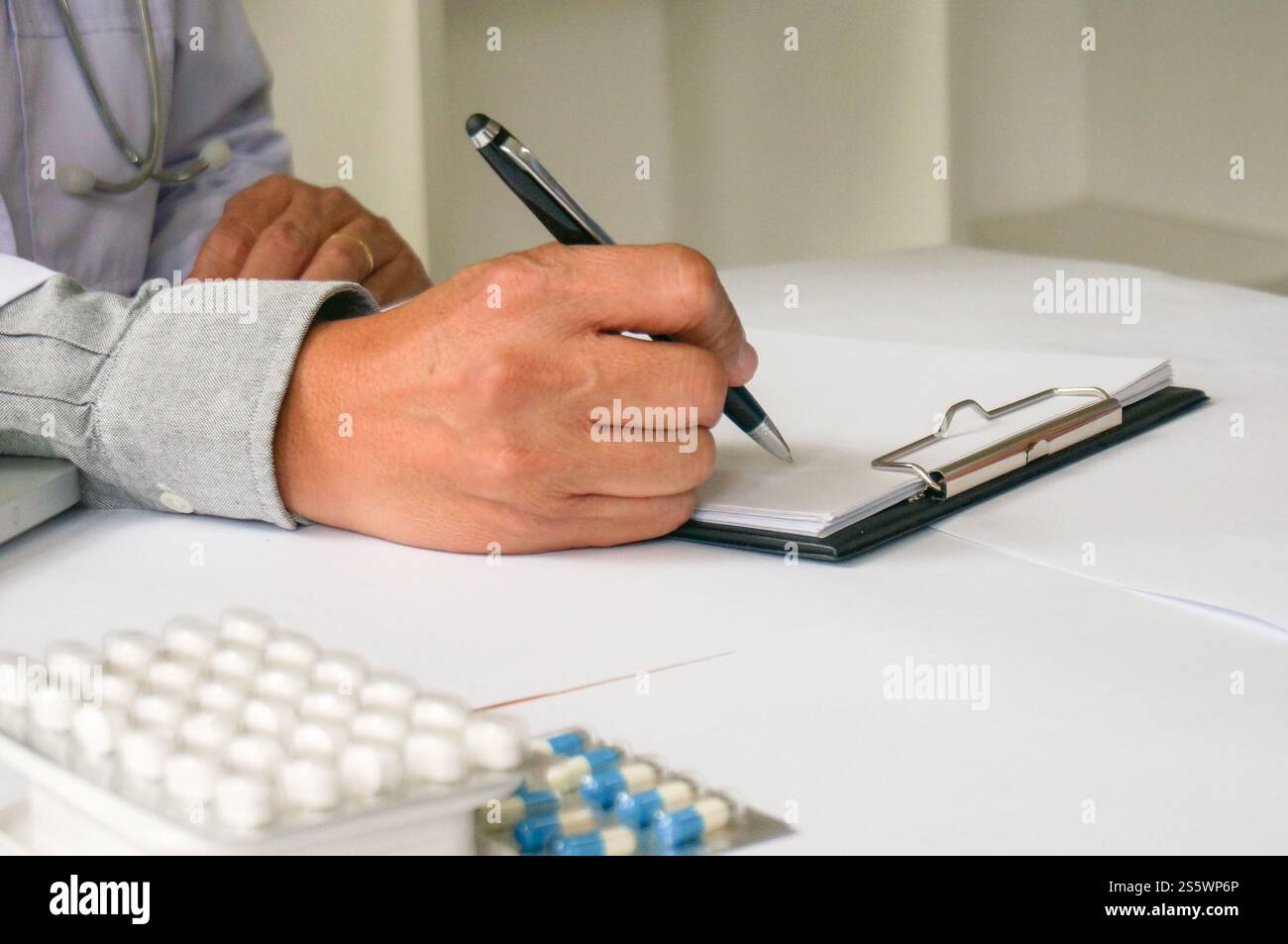 Medicine Doctor hand holding pack of different tablet blisters for ...