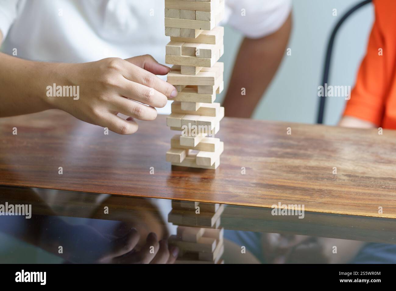 Asian father and son playing wood blocks game Carefree kid playing wood ...