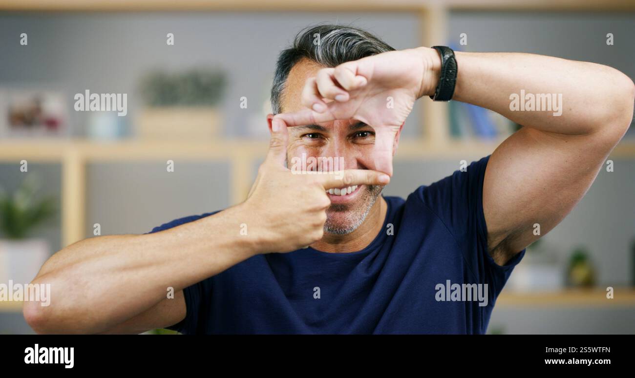Man, finger frame and photographer in portrait, creative director and ...